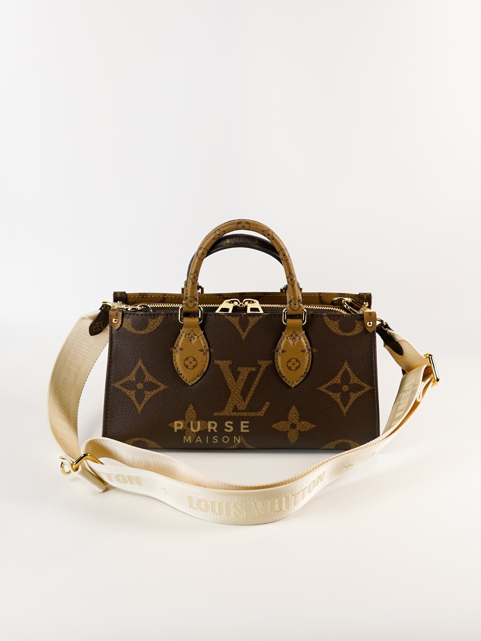 On The Go (OTG) East West in Reverse Monogram Canvas